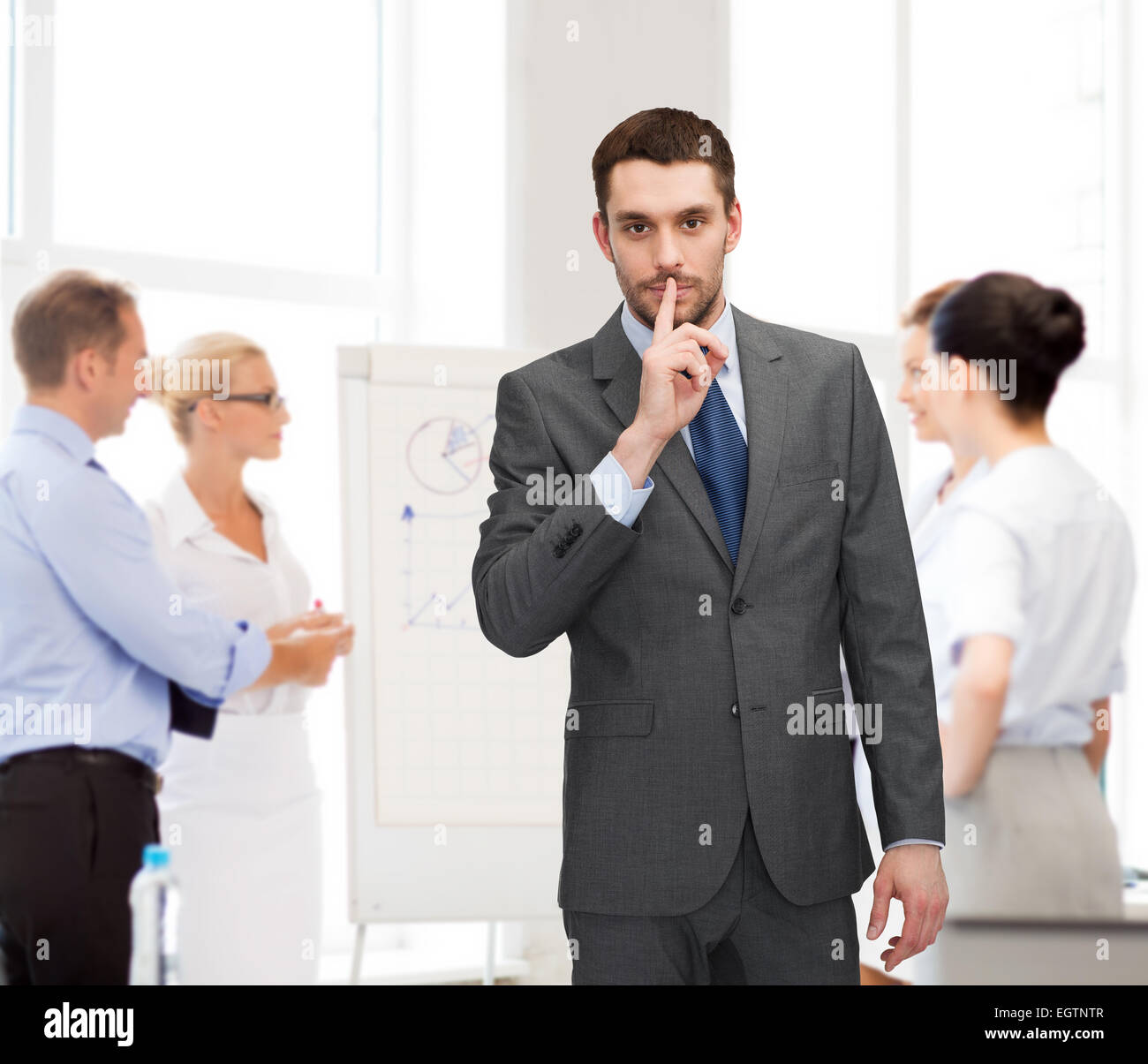 group of businessmen making hush sign Stock Photo - Alamy