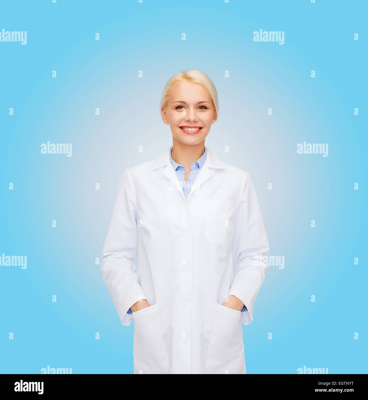 smiling female doctor over blue background Stock Photo - Alamy