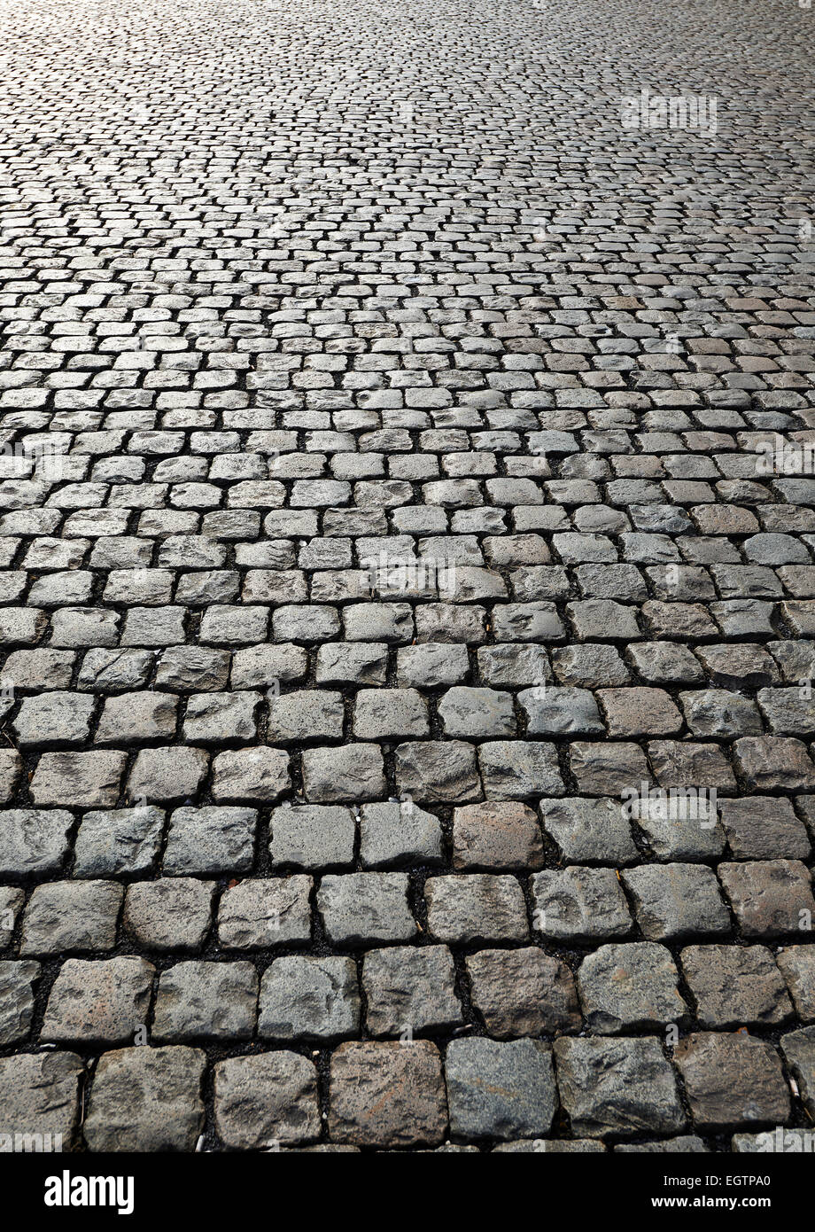 Cobbled road on industrial site Stock Photo - Alamy