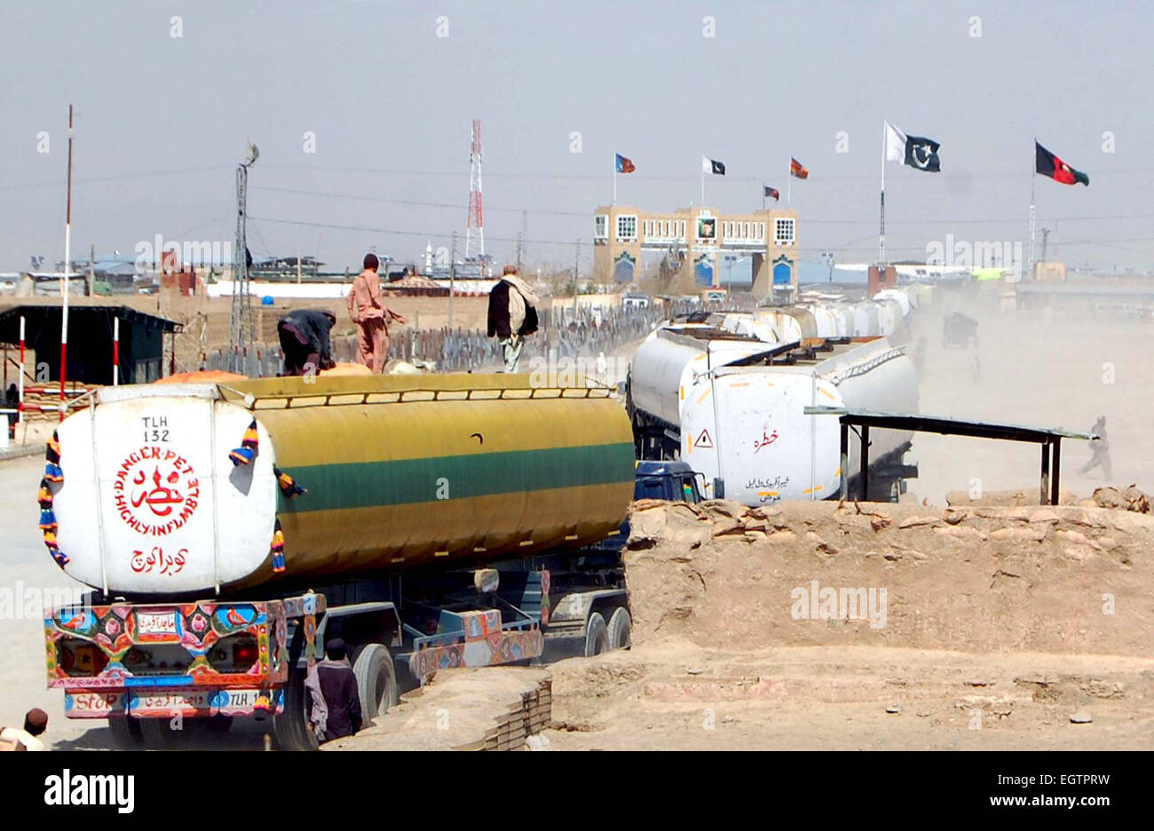 Pakistani trucks carry the fuel supply for the NATO and U.S forces are ...