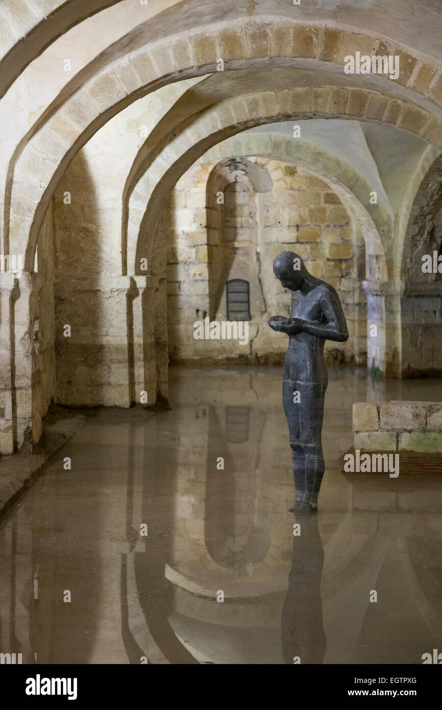 Flooded crypt of Winchester Cathedral containing Antony Gormley’s ...