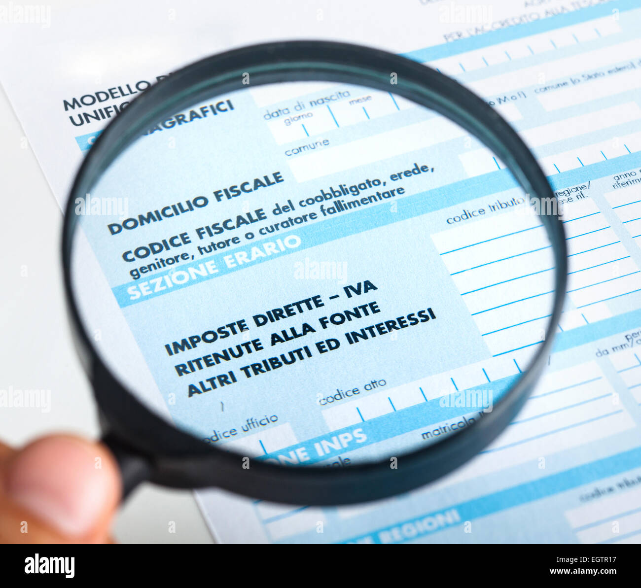 F24 for the tax return in Italy with magnifying glass Stock Photo - Alamy
