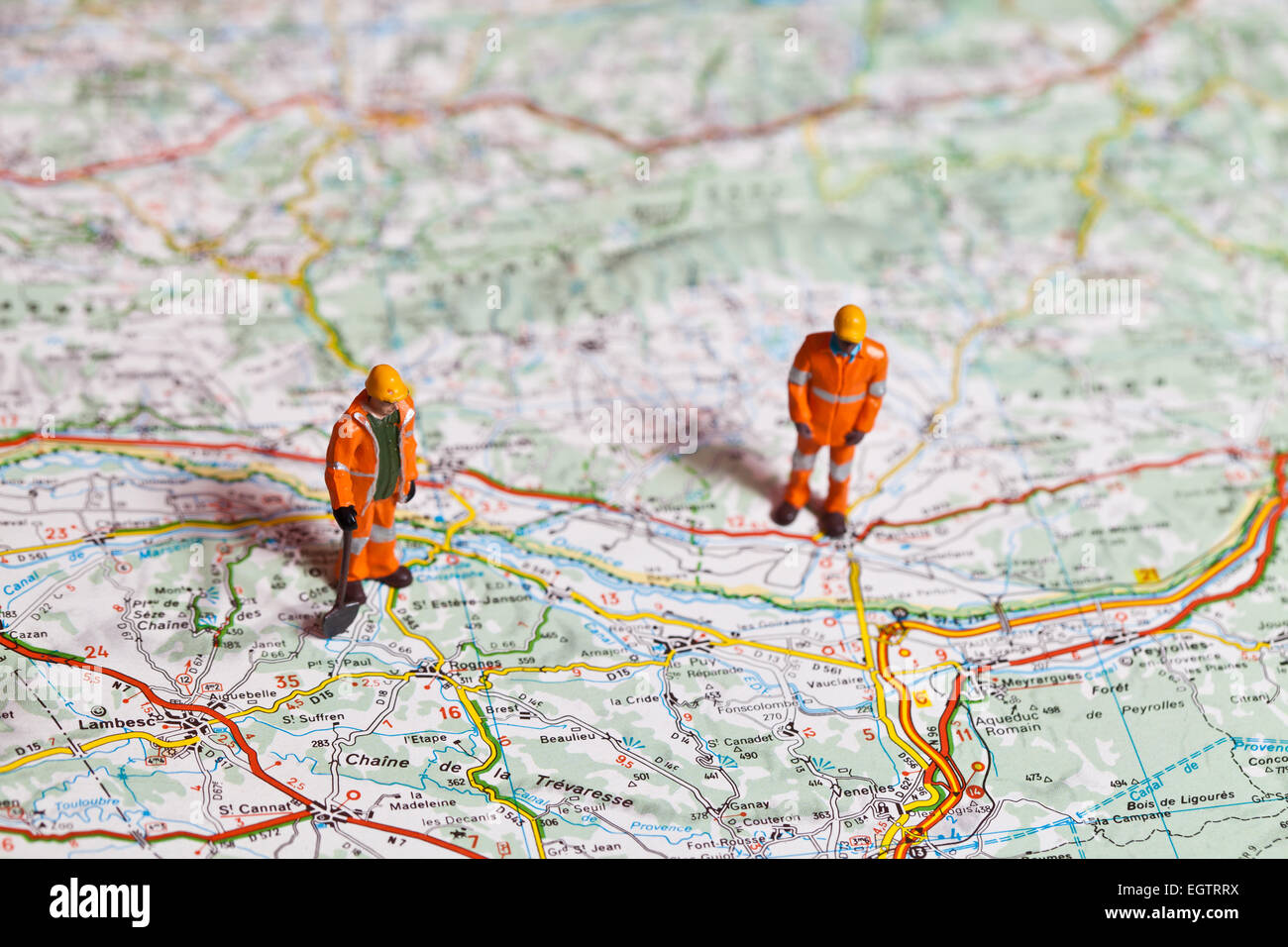 Miniature people on a map Stock Photo - Alamy