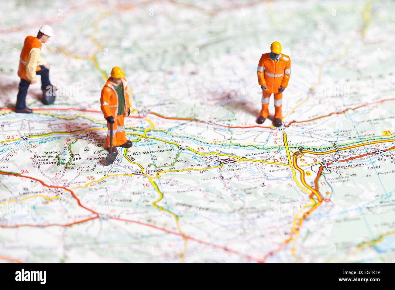 Miniature people on a map Stock Photo - Alamy
