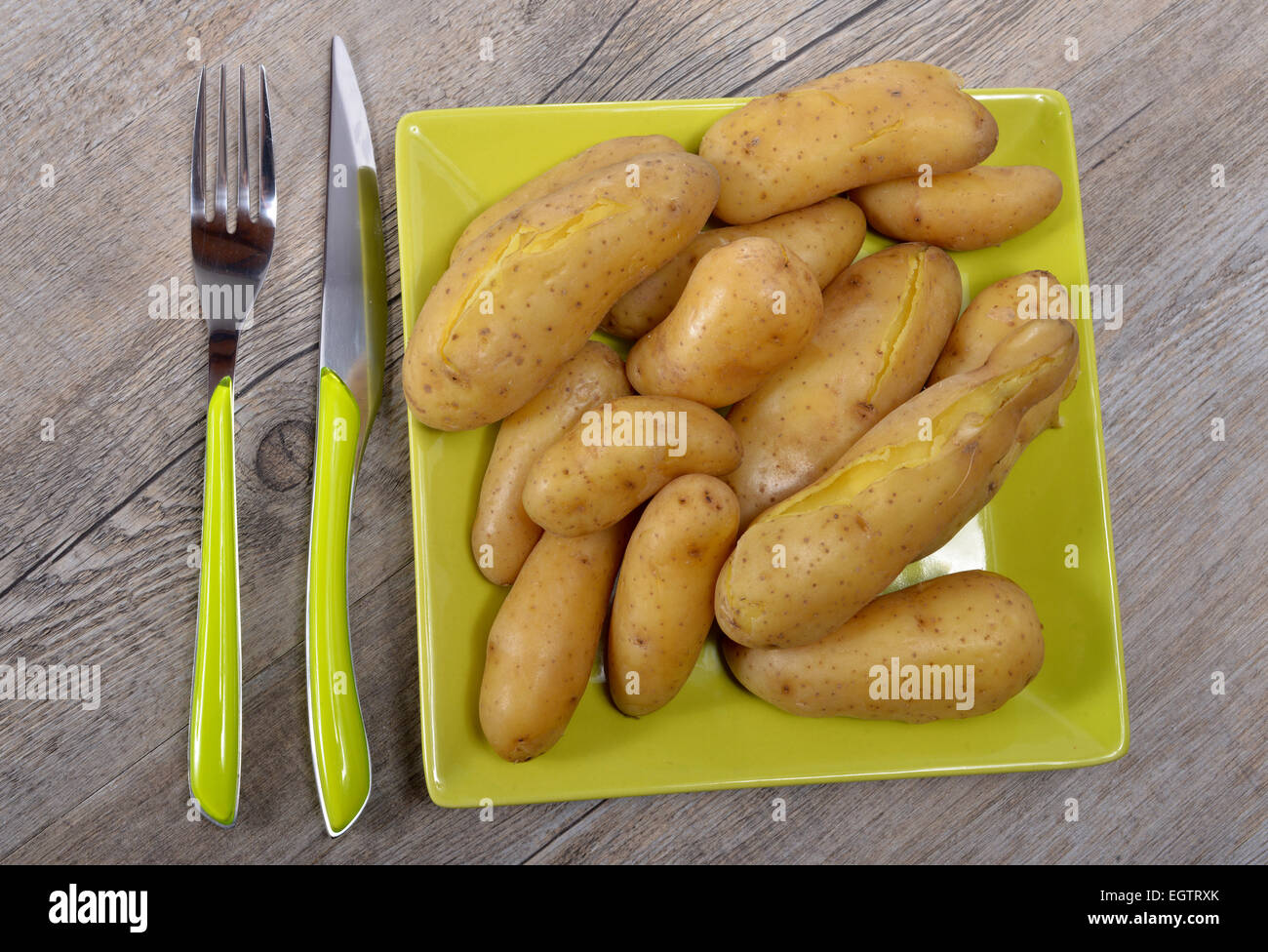 Potatoes in a green plate Stock Photo - Alamy