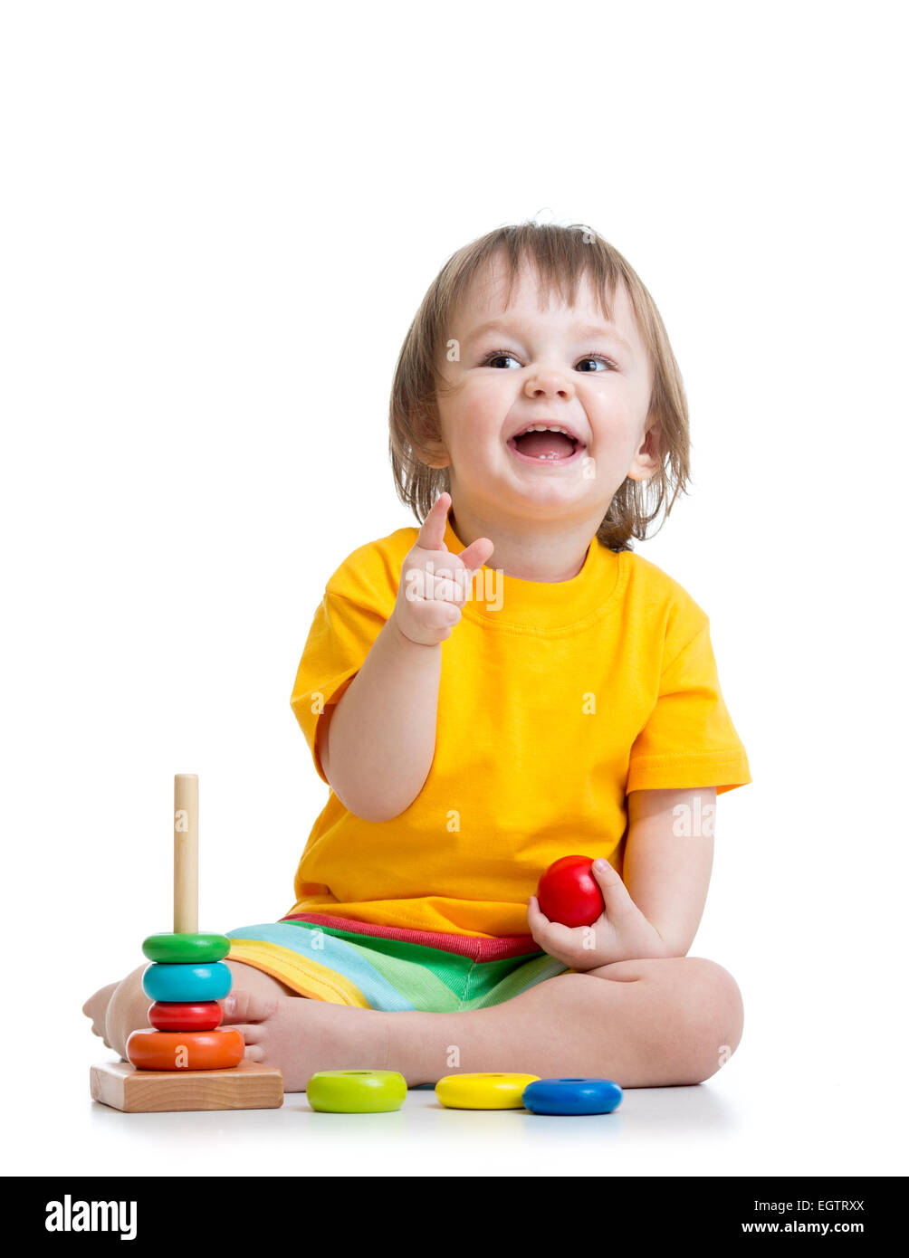 baby boy playing with colorful toy Stock Photo - Alamy