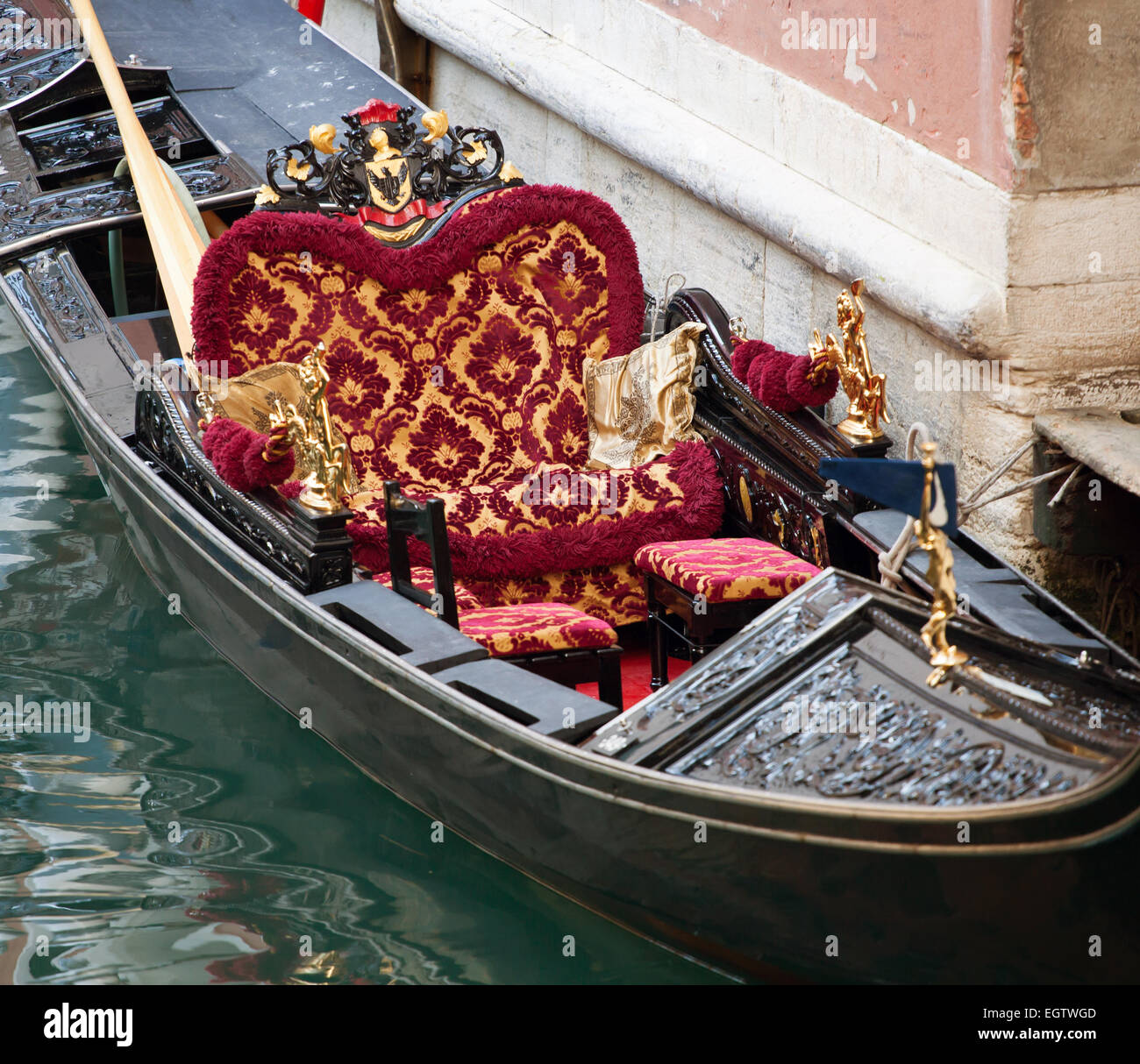 Luxurious interior of a gondola in Venice with precious carpets and ...