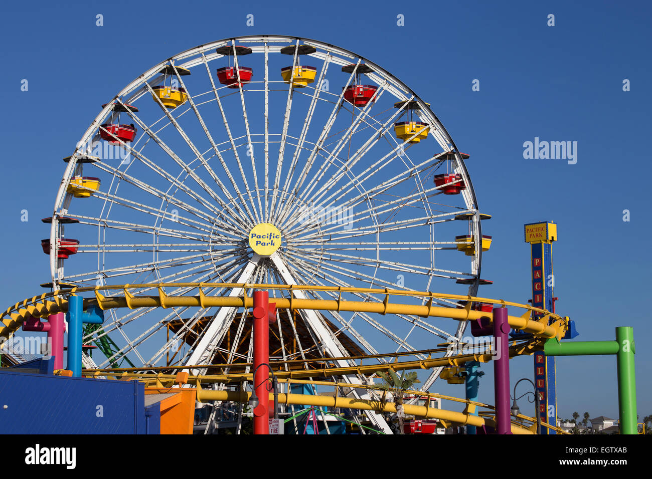 Ferris Wheel and roller coaster in Pacific Park, Santa Monica Pier ...