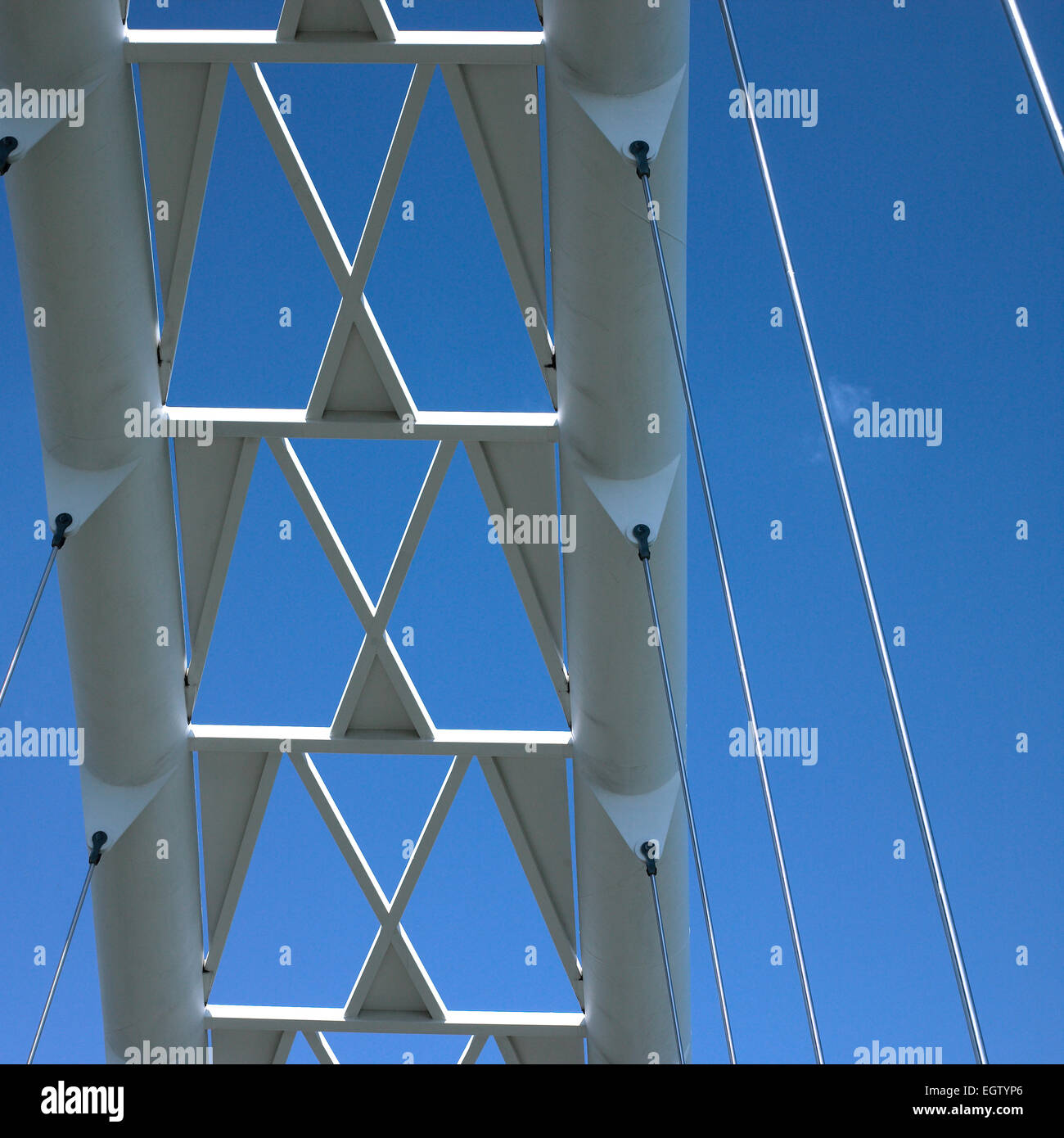 Looking up at a modern white bridge structure Stock Photo - Alamy