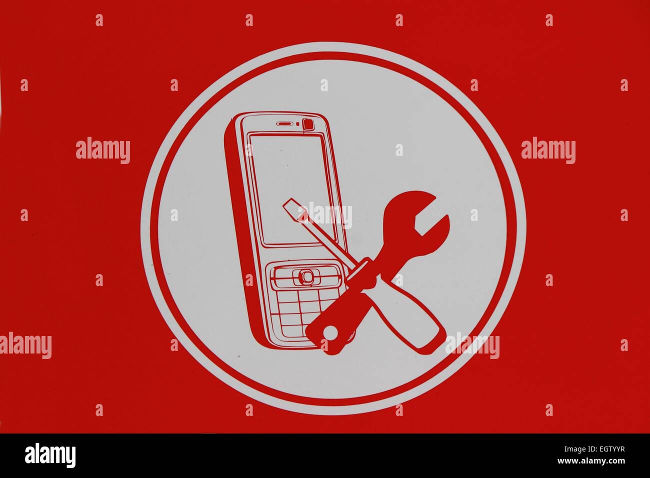 on a red background shows the icon repair mobile phone Stock Photo - Alamy