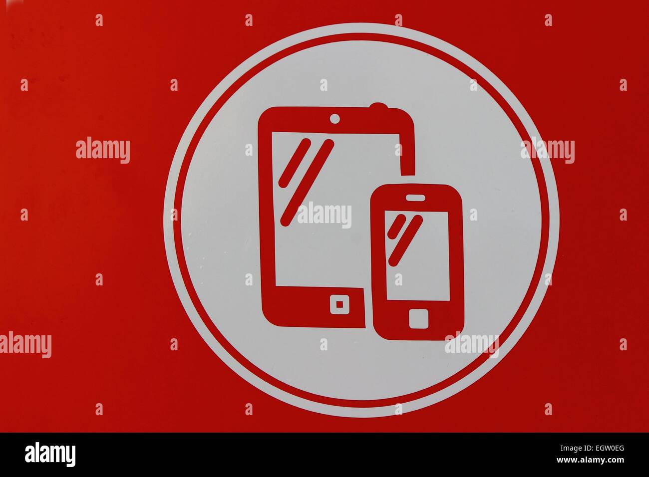 on a red background shows the icon of the smartphone Stock Photo - Alamy