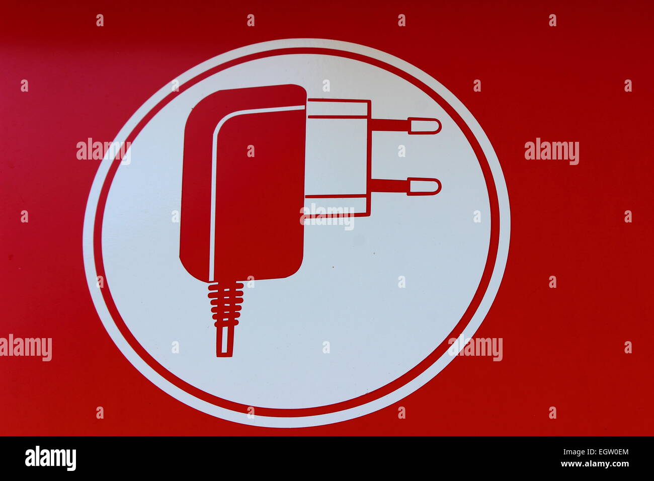 on a red background shows the icon charger Stock Photo - Alamy