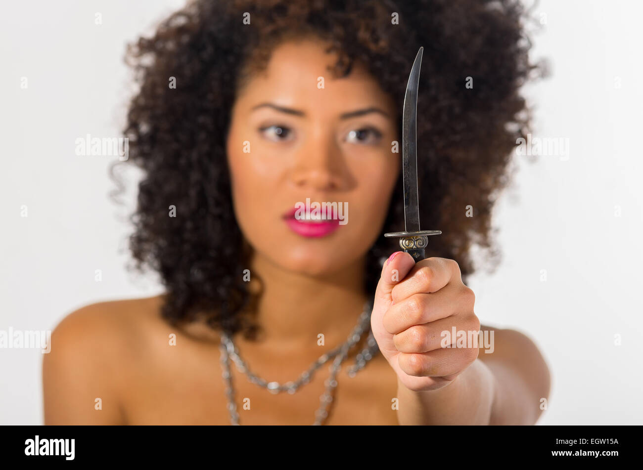 beautiful exotic young tribal woman holding a dagger Stock Photo - Alamy