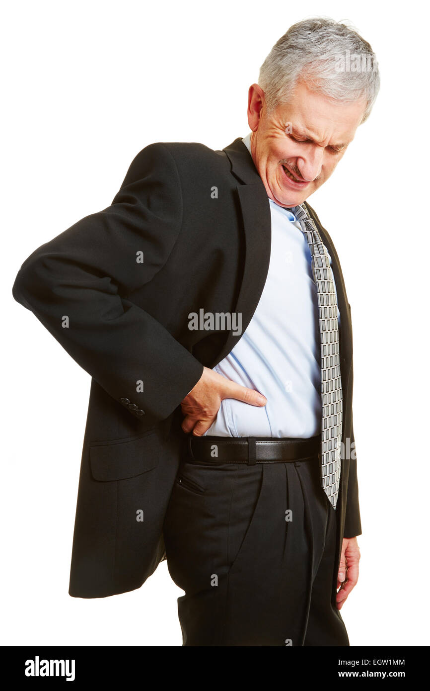 Old business man having back pain and holding hand to his aching back ...
