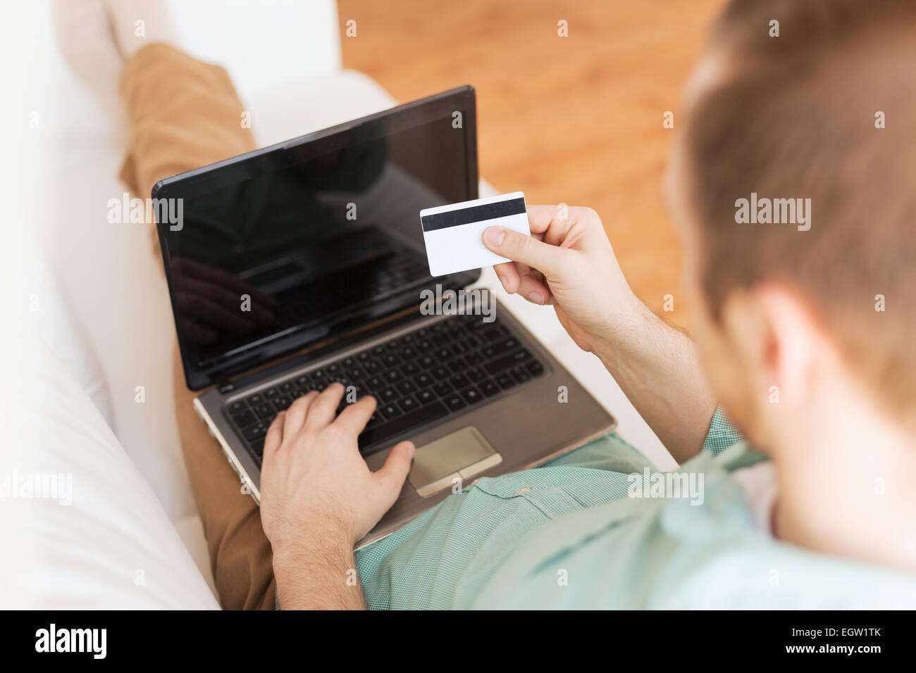 close up of man with laptop and credit card Stock Photo - Alamy