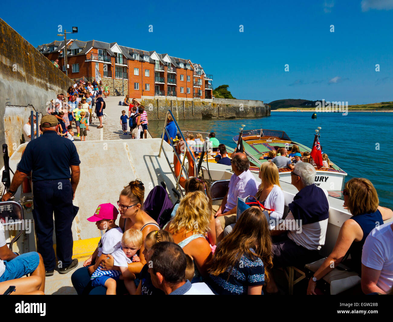 Passenger ferry Black Tor arriving at Padstow Quay from Rock in North Cornwall England UK using ...