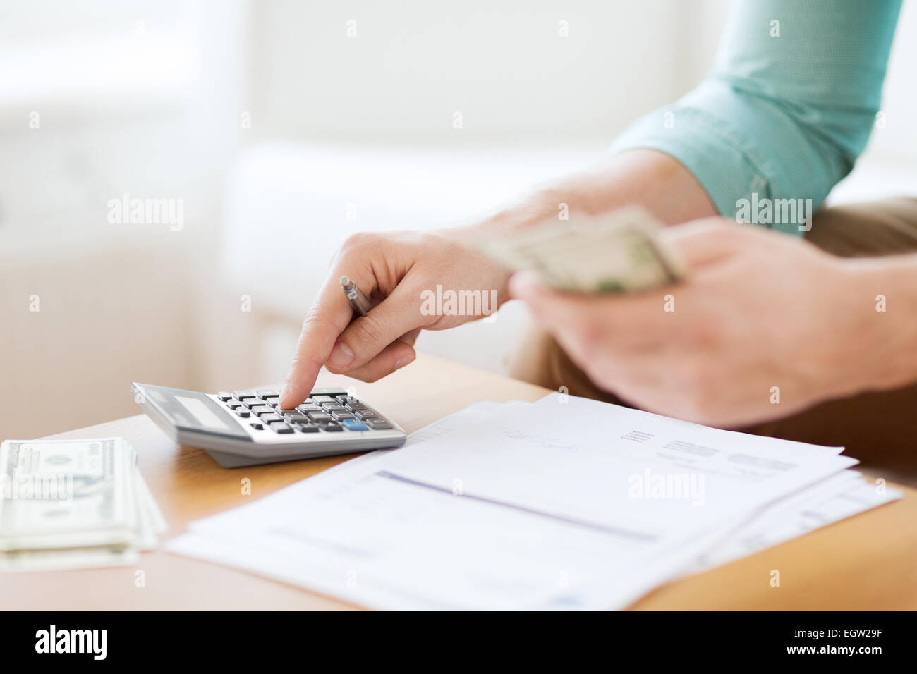 close up of man counting money and making notes Stock Photo - Alamy