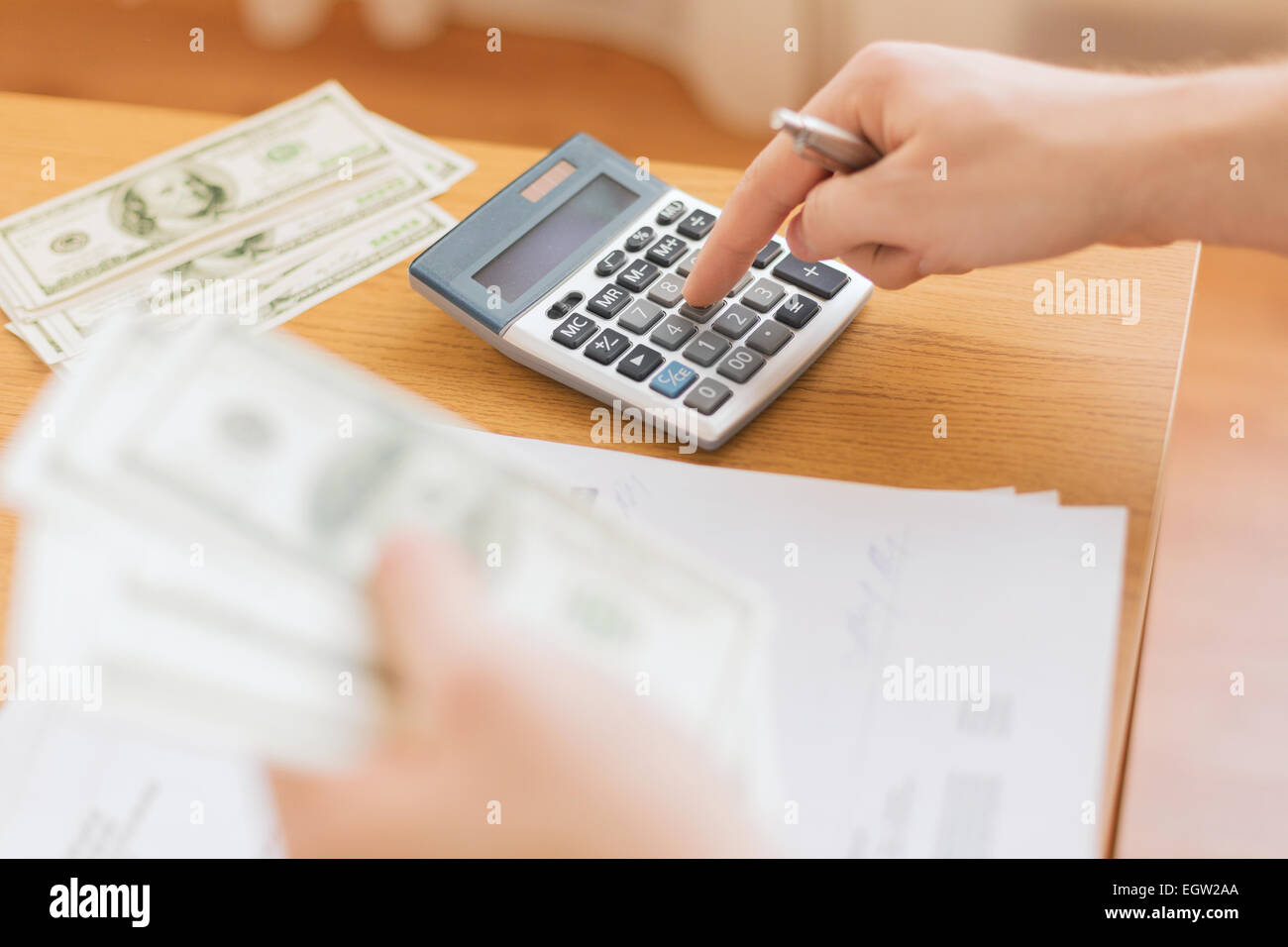 close up of man counting money and making notes Stock Photo - Alamy