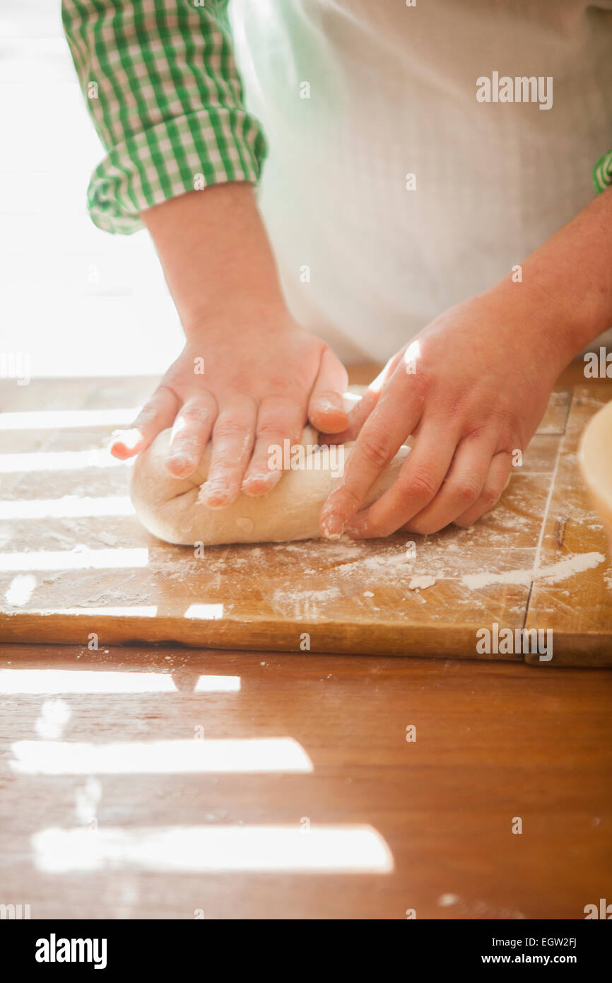 Woman's hands kneading dough Stock Photo - Alamy