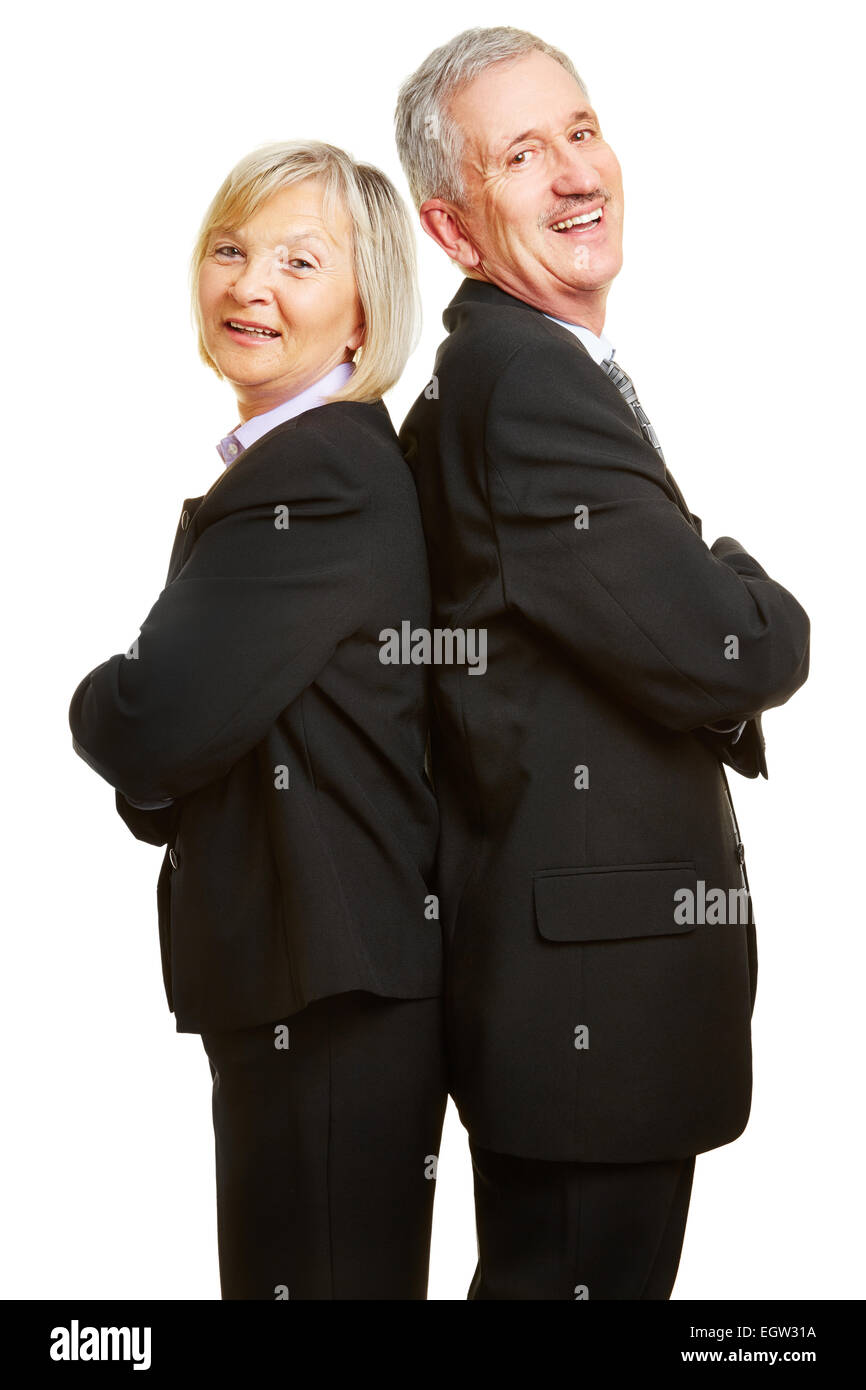 Happy senior couple as businesspeople leaning back to back with their ...