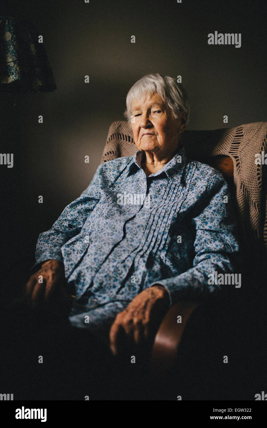 Stern looking woman sitting in hi-res stock photography and images - Alamy