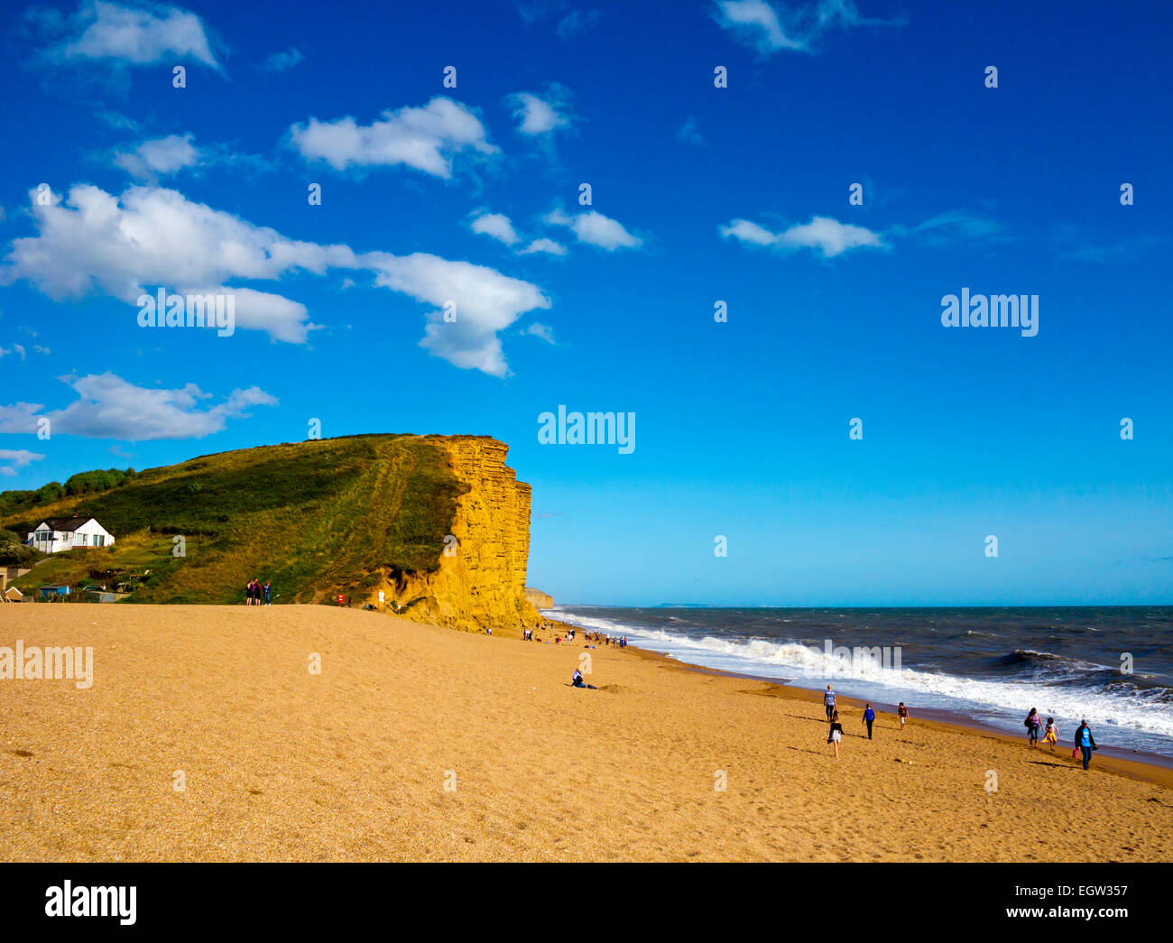 Sandstone cliffs and beach in summer on the Jurassic Coast near West ...