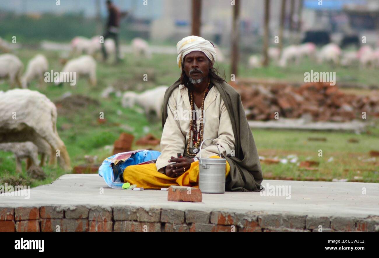 A sadhu offer ritual at Sangam in Allahabad. Sadhus are an India's ...