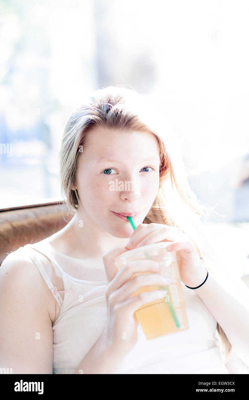 Portrait of tween/teen girl drinking Stock Photo - Alamy