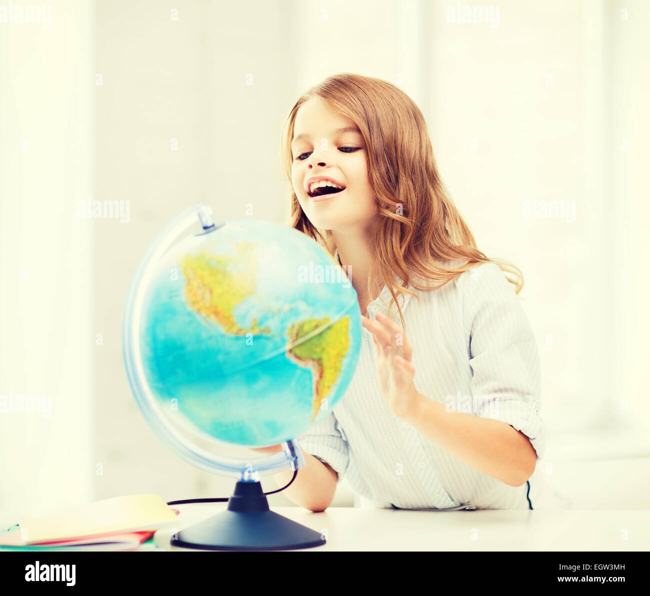 student girl with globe at school Stock Photo - Alamy