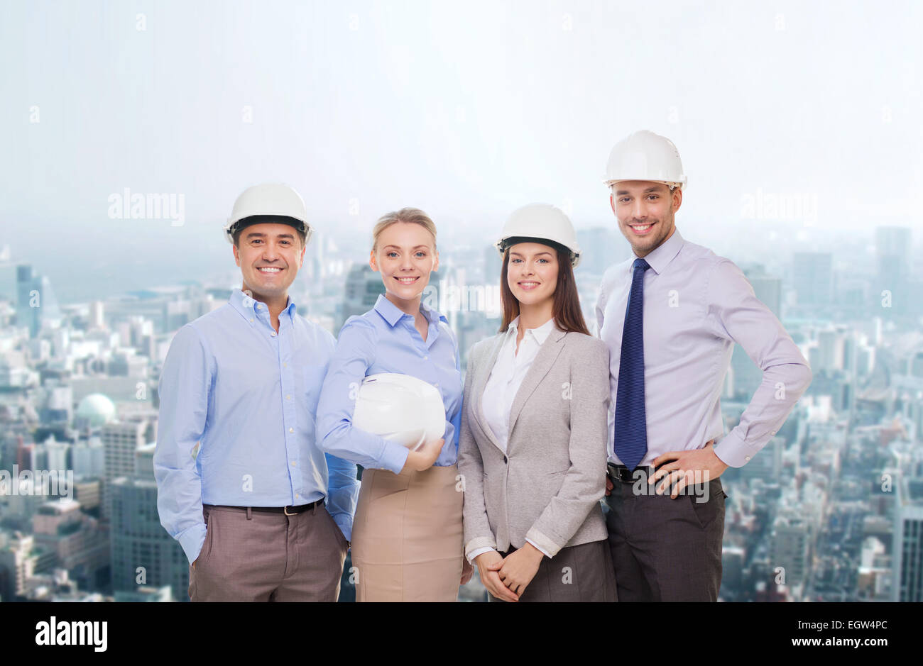 group of smiling businessmen in white helmets Stock Photo - Alamy