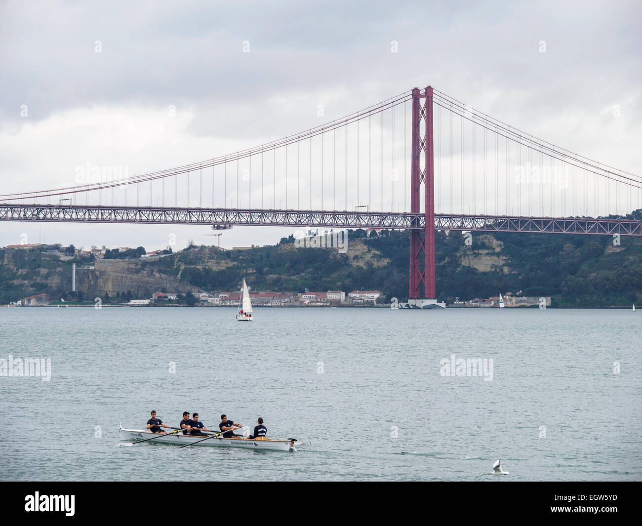 Rowing team training in the Tagus river with the 25 de Abril suspension ...