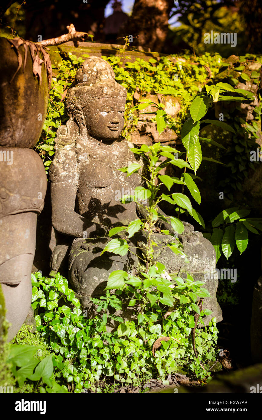 The old stone Buddha statue. Indonesia, Bali Stock Photo - Alamy