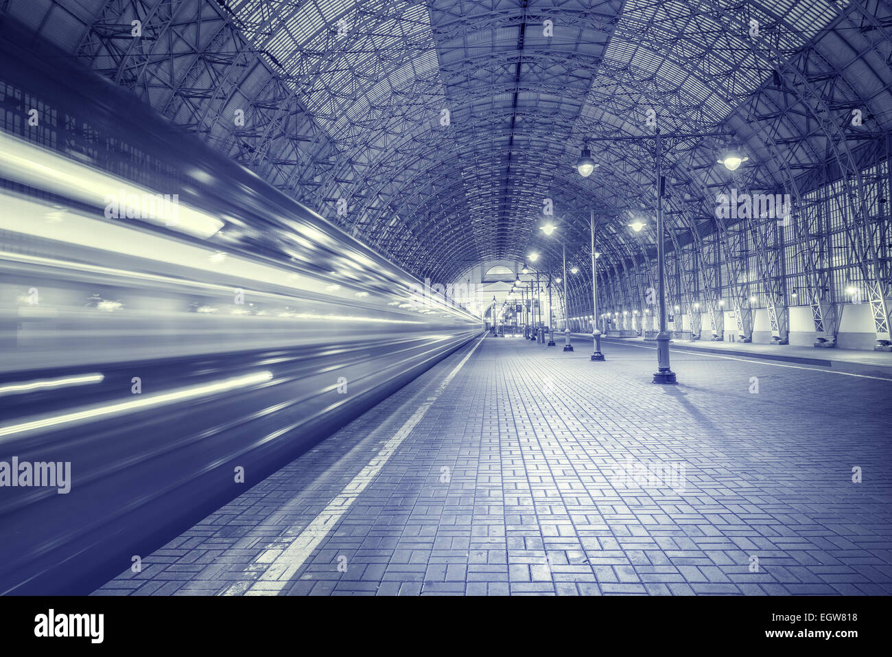 High speed train departs from the station at night time Stock Photo - Alamy
