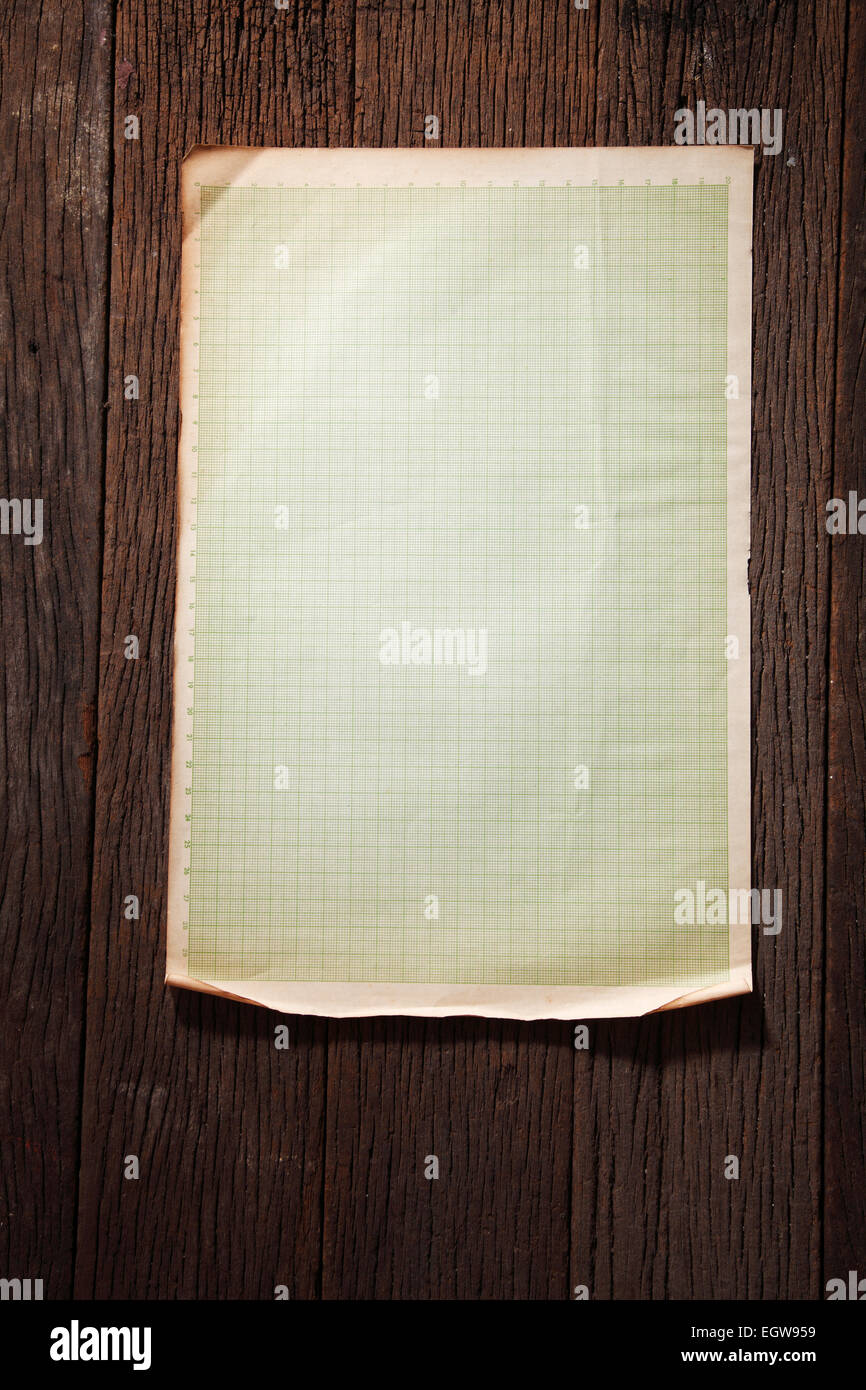 old paper stick on wood background Stock Photo - Alamy