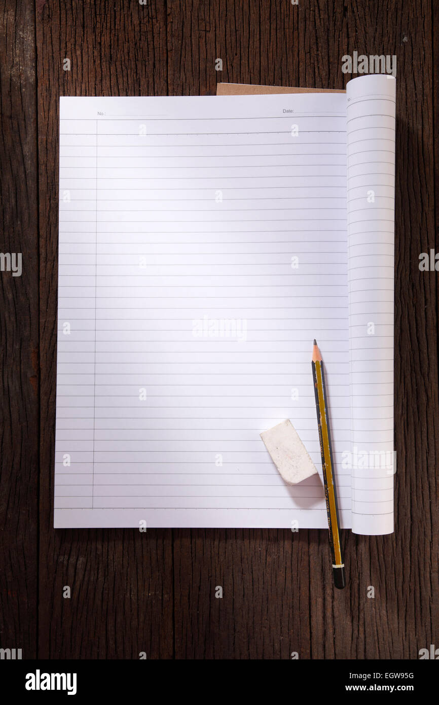 exercise book with pencil and eraser on the wooden background Stock ...