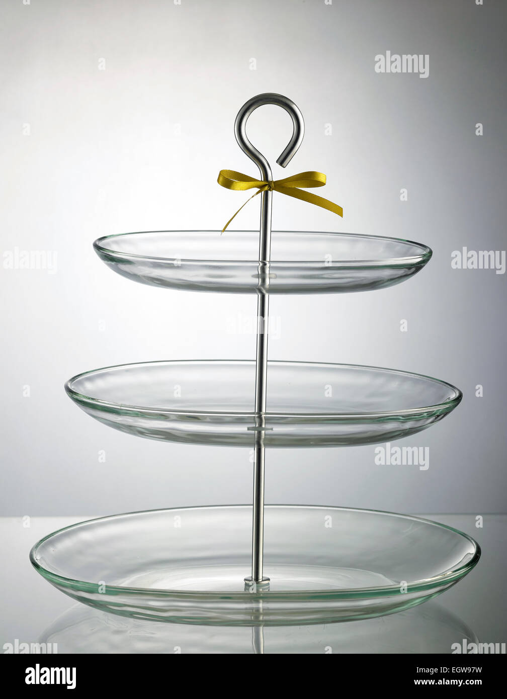 three tier plate on the with little ribbon Stock Photo - Alamy