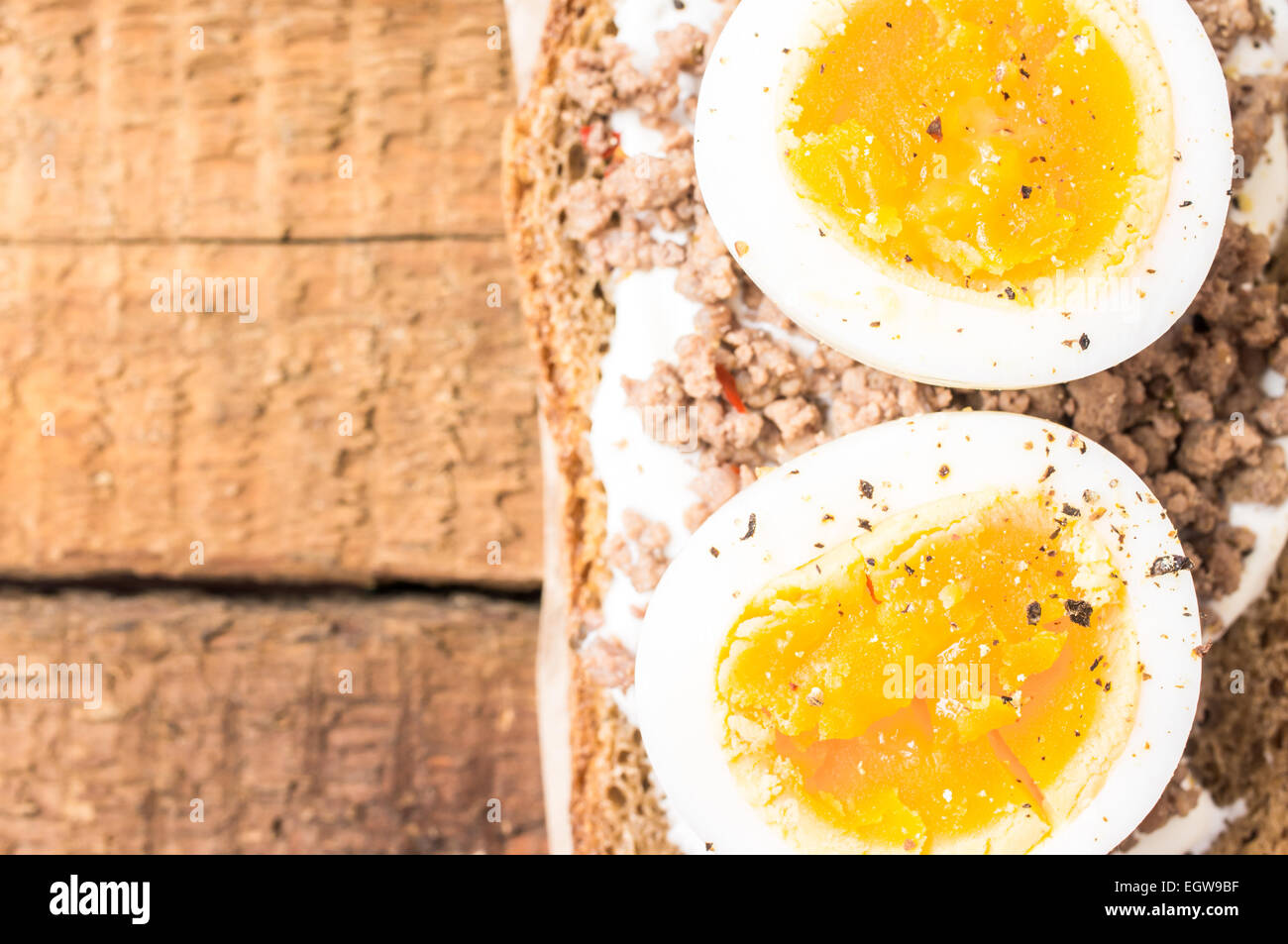 Sandwich with egg and minced meat for breakfast Stock Photo - Alamy