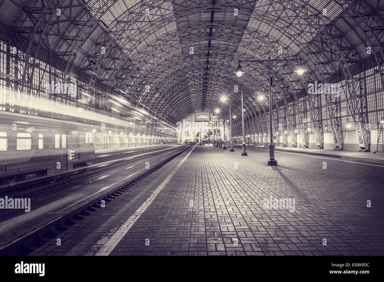 High speed train departs from the station at night time Stock Photo - Alamy
