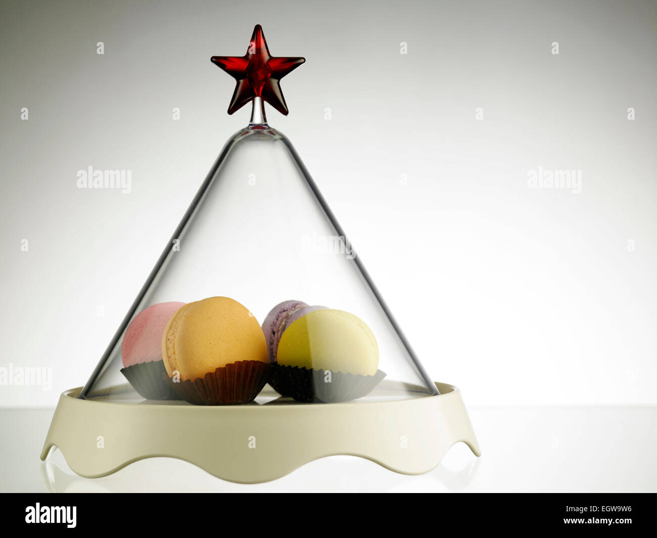 colorful macaron in the triangle glass container with star on top Stock ...