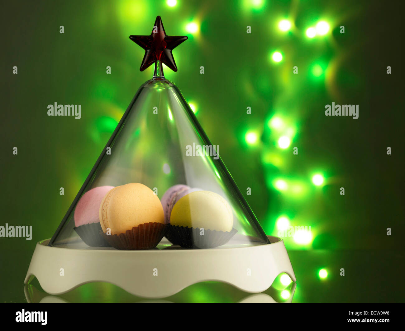 colorful macaron in the triangle glass container with star on top Stock ...