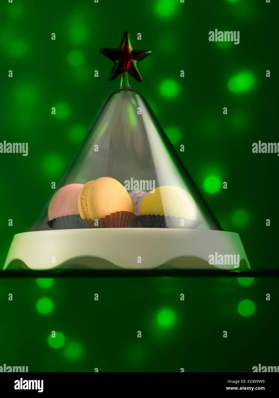 colorful macaron in the triangle glass container with star on top Stock ...