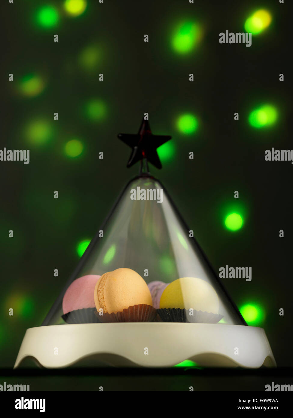 colorful macaron in the triangle glass container with star on top Stock ...