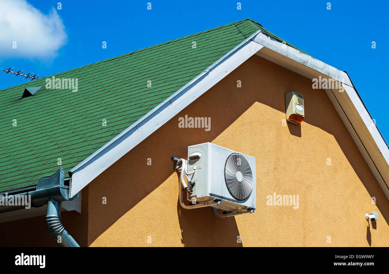 Air conditioner and security system on the wall of a building Stock ...