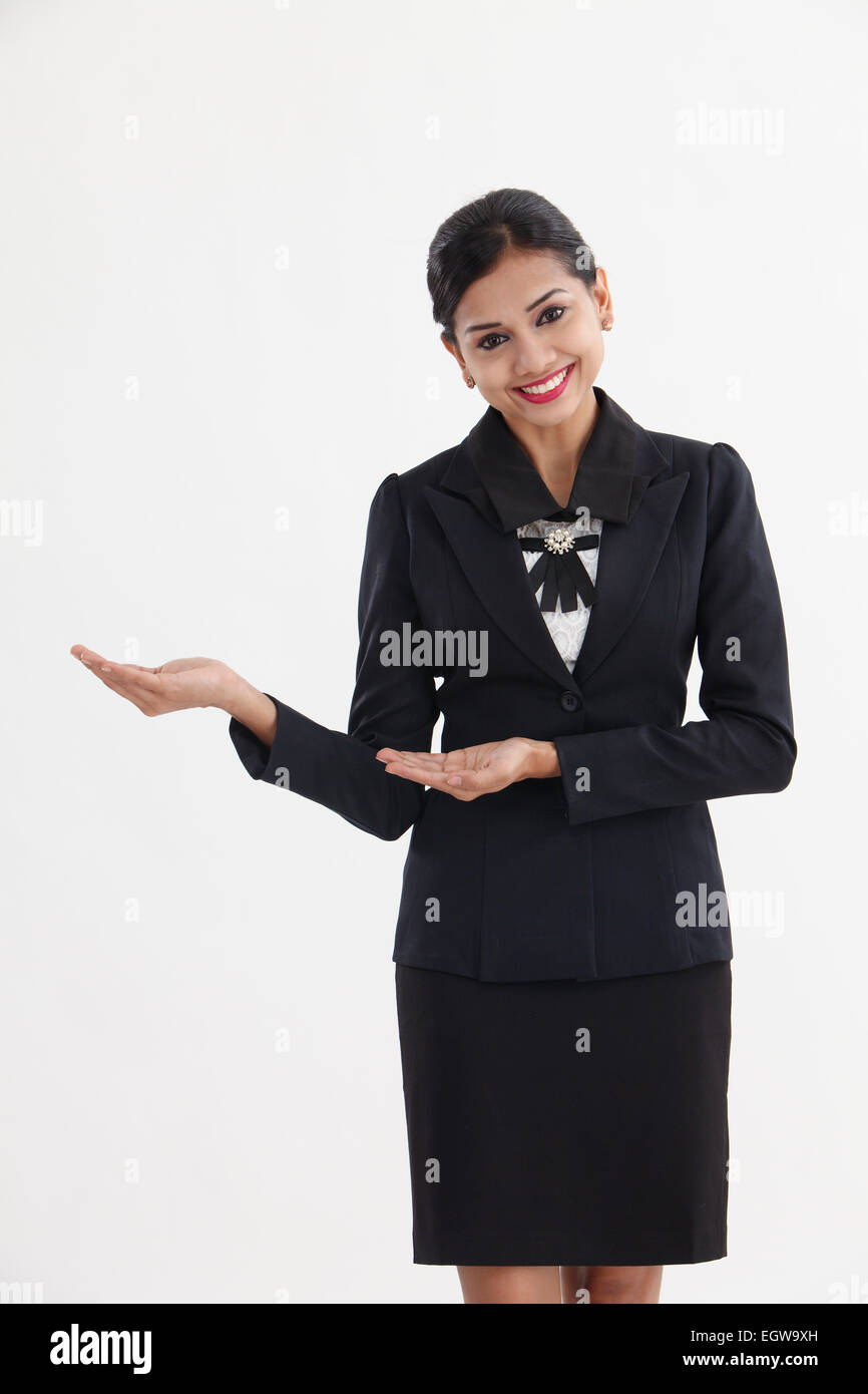 front view of indian businesswoman showing direction Stock Photo - Alamy