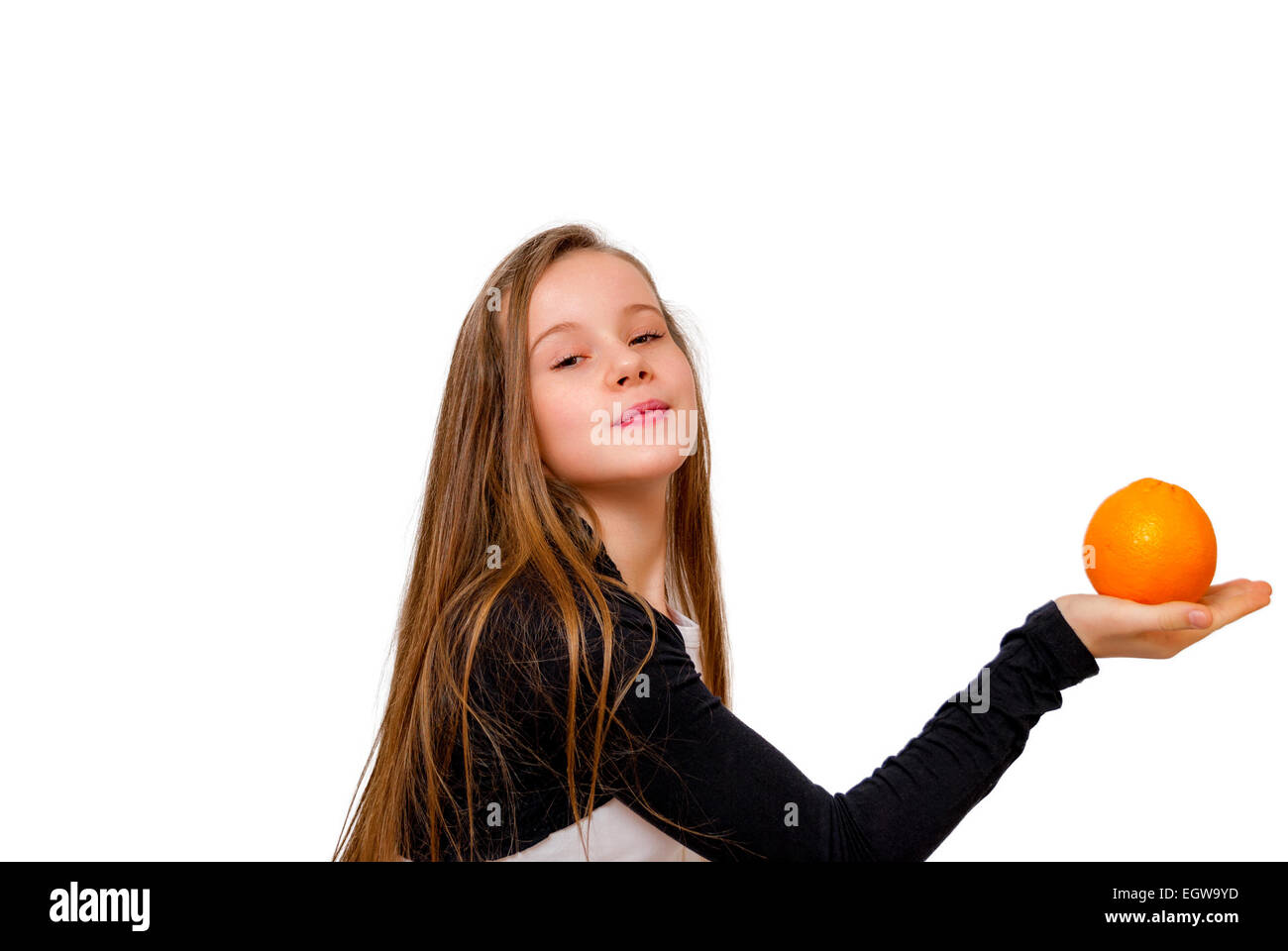 Little girl with orange isolated on white Stock Photo - Alamy