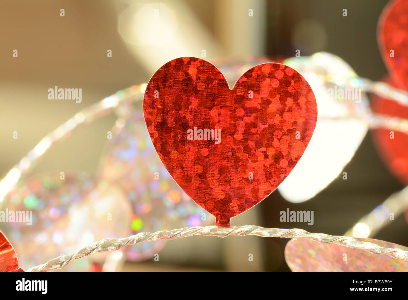 Red flat foil heart on string Close up- hanging hearts decoration for ...