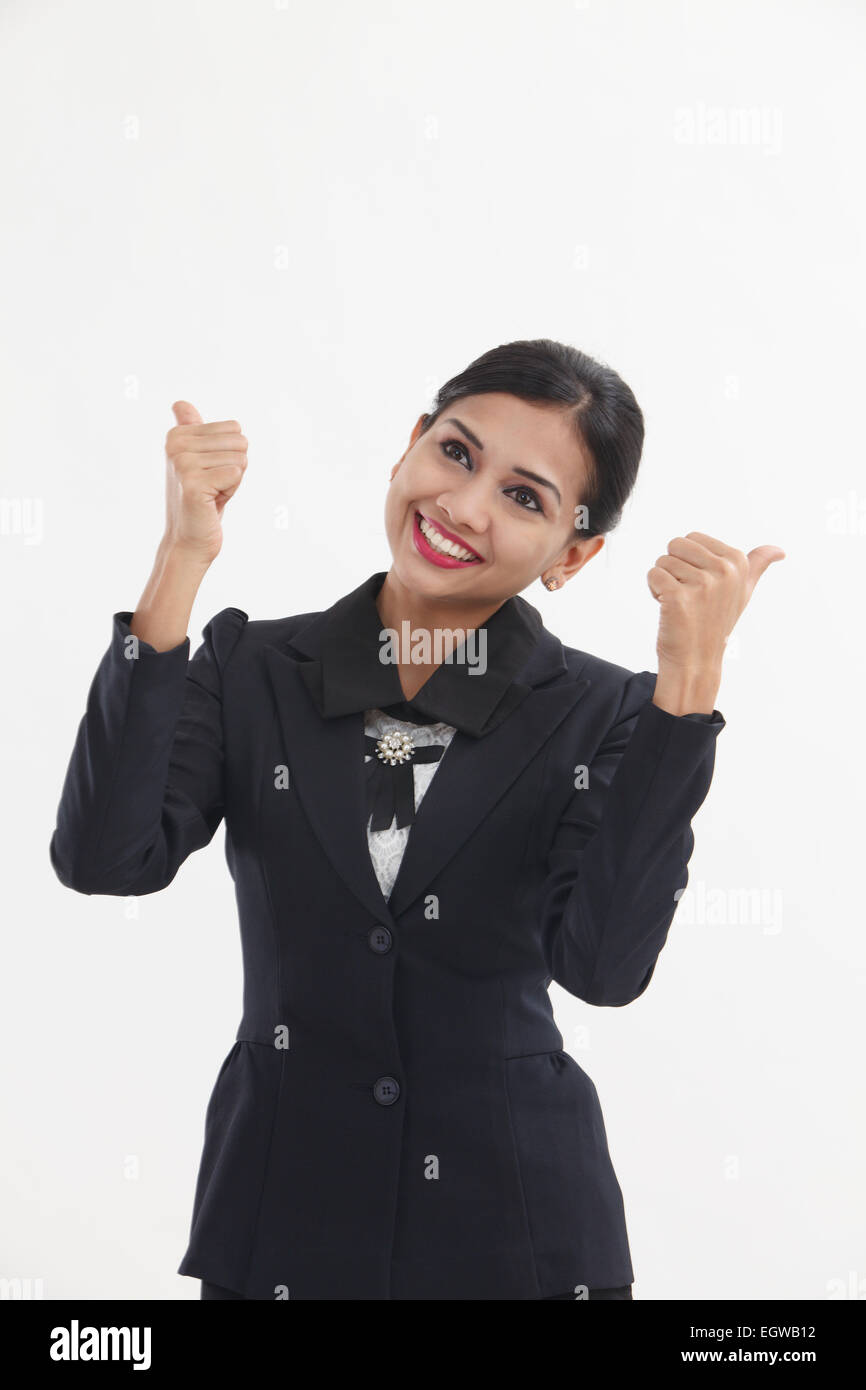 formal Asian Business woman with thumbs up Stock Photo - Alamy