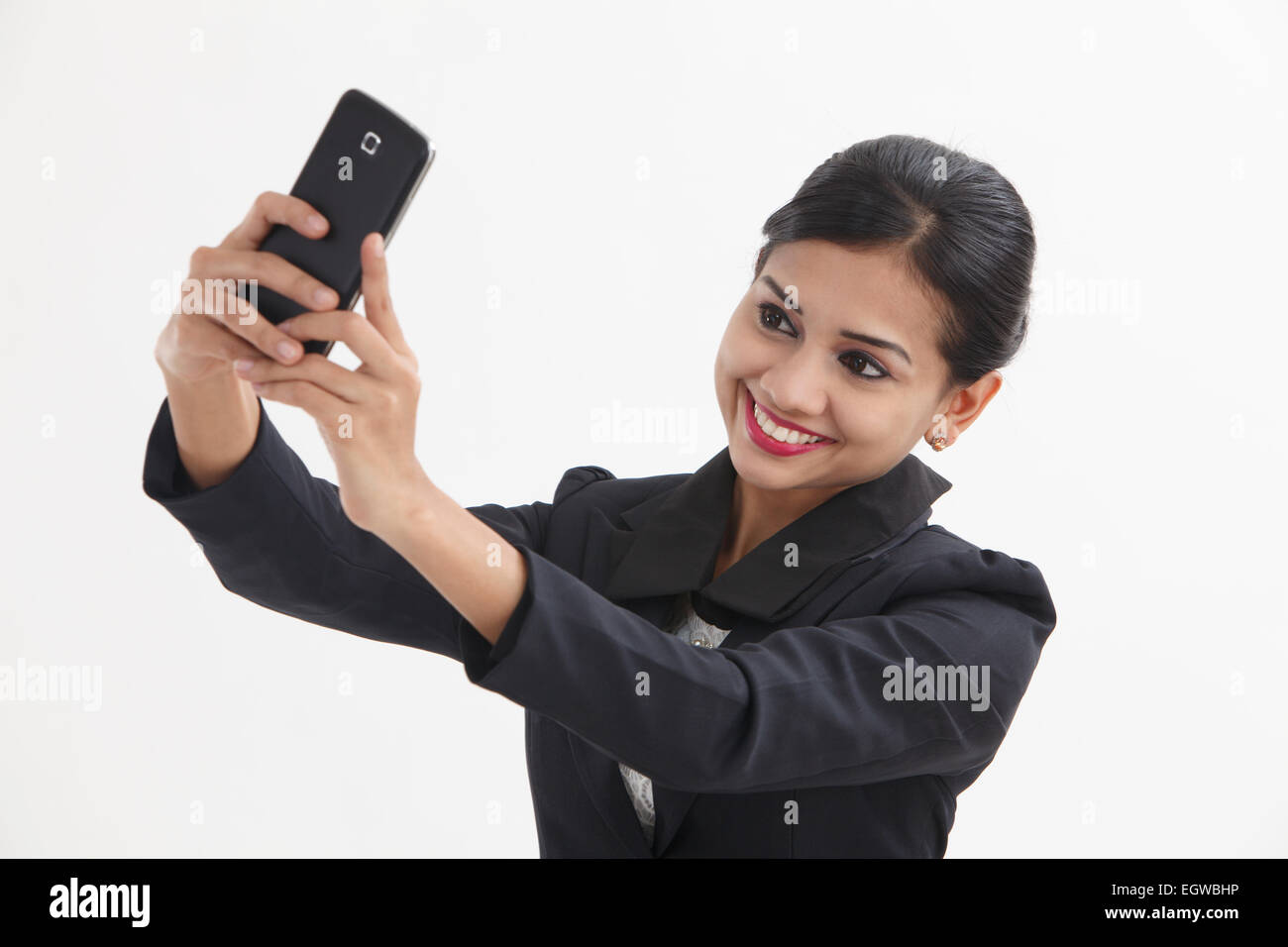 Front view business woman self portrait with smart phone Stock Photo ...