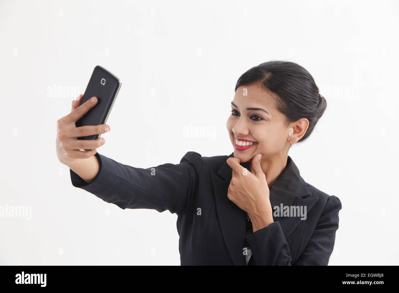 Front view business woman self portrait with smart phone Stock Photo ...