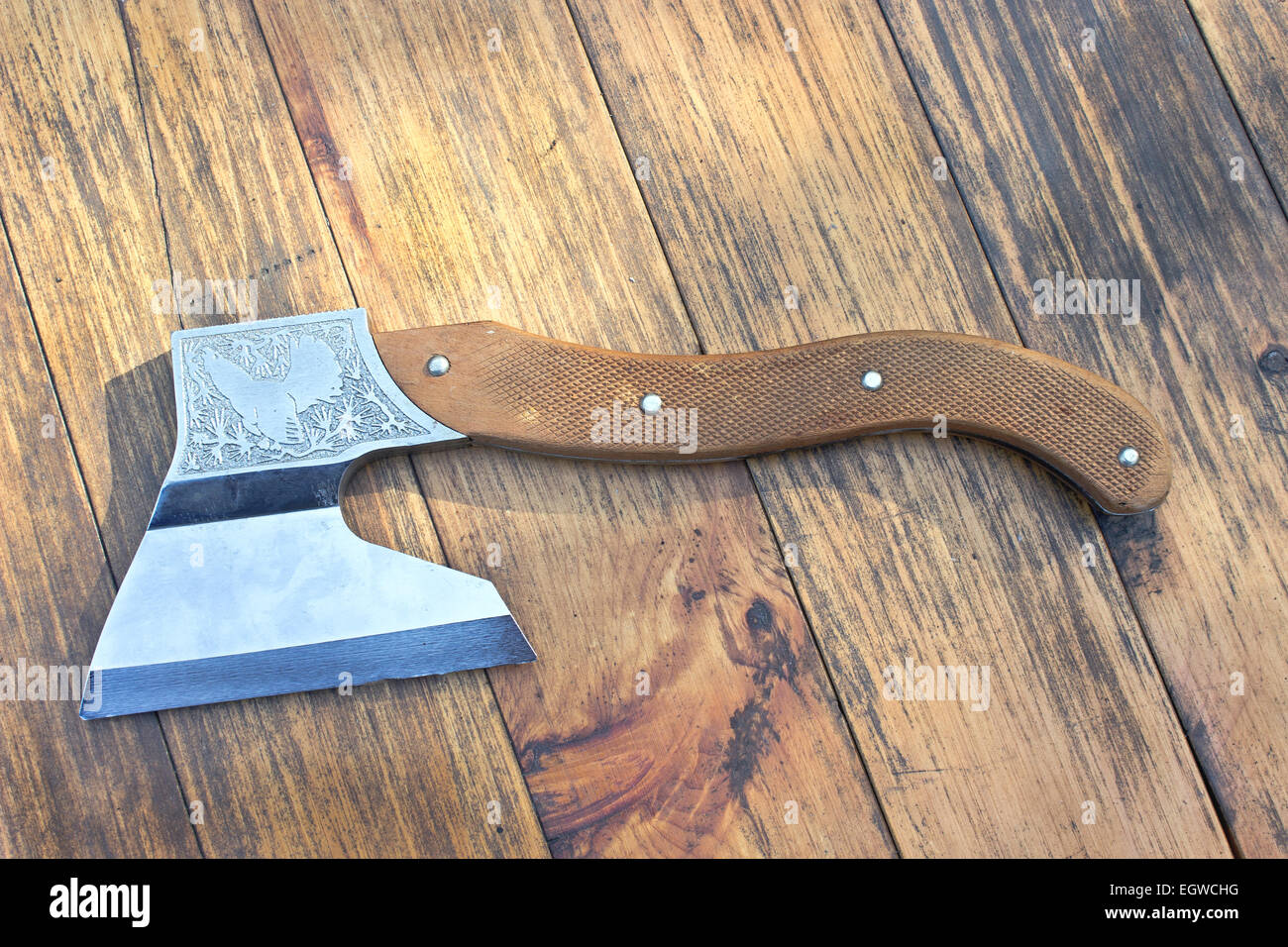 Old ax over wooden background Stock Photo - Alamy